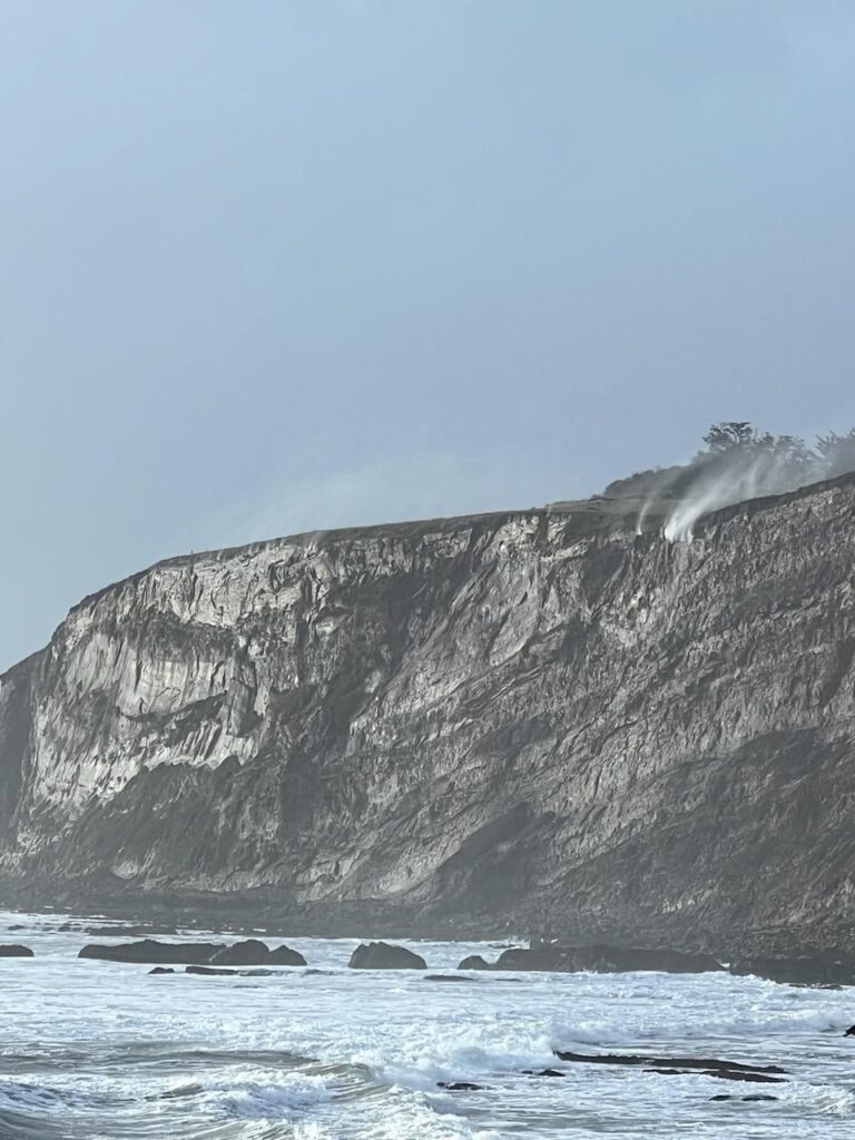 A rare reverse waterfall at Arena Cove, as photographed by Catherine ...